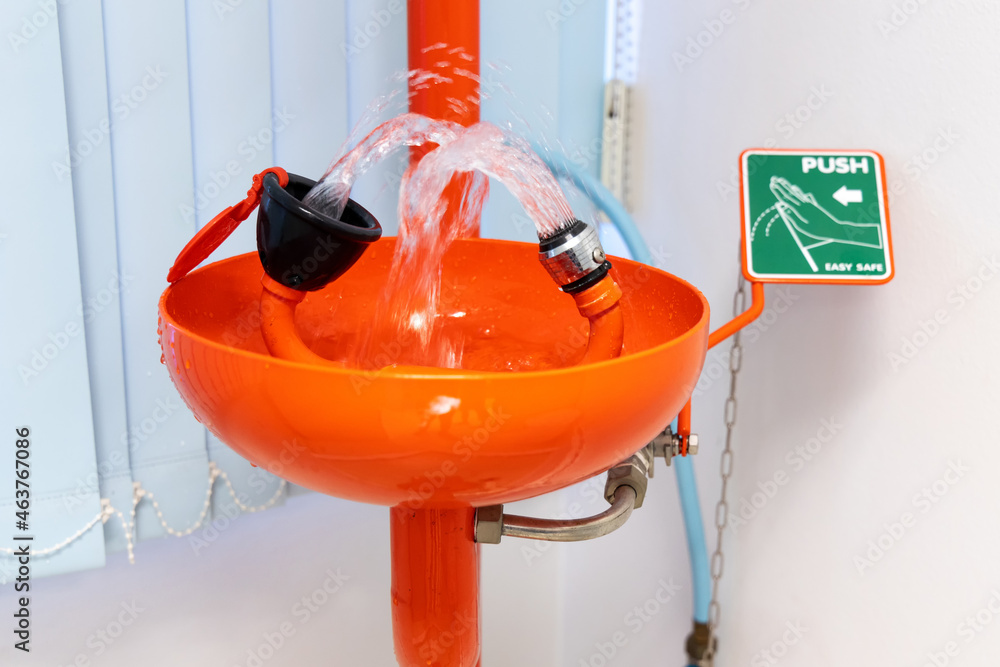 Emergency eyewash stations in the safety of workers with water flowing ...