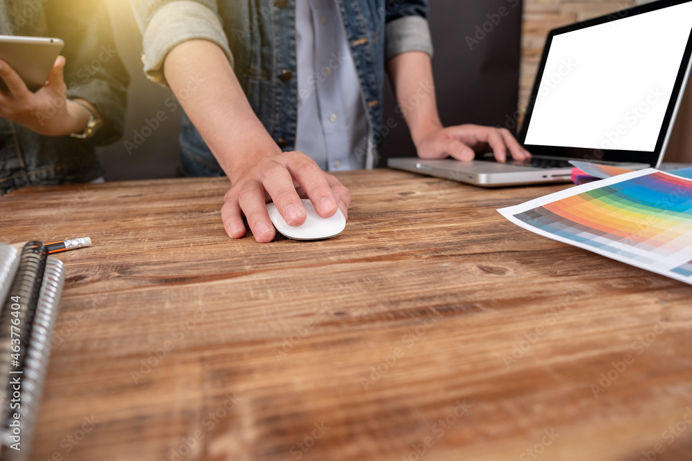 Designer Young asian using graphics tablet while working with computer ...