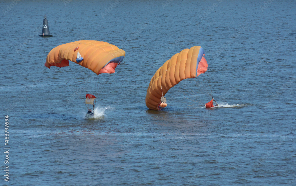 Two military parachutists landing on water, paratroopers training Stock ...