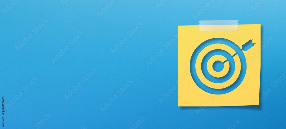 Yellow sticky note paper and target sign with copy space on panoramic ...