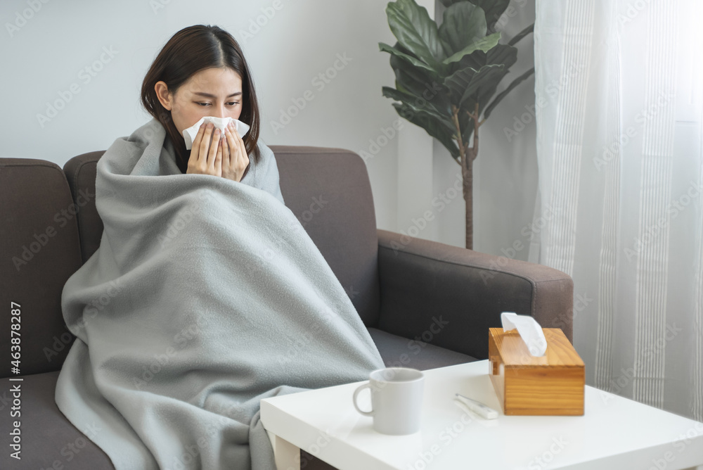 Sick day at home. Asian woman has runny and common cold. Stock Photo ...