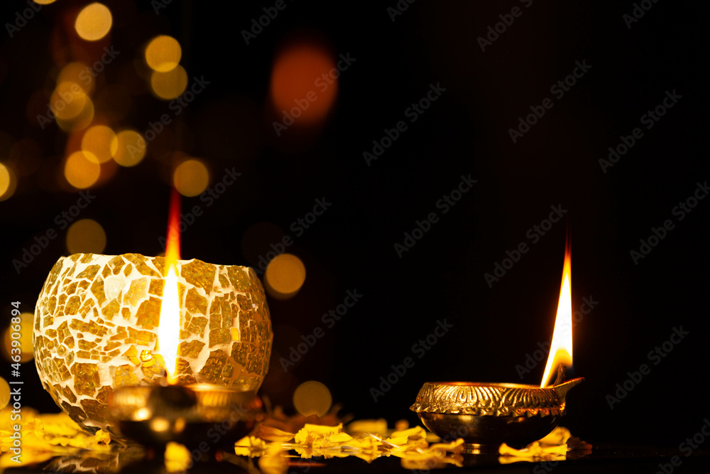 Brass Golden Diya Illuminated with golden bokeh in Dark Black ...