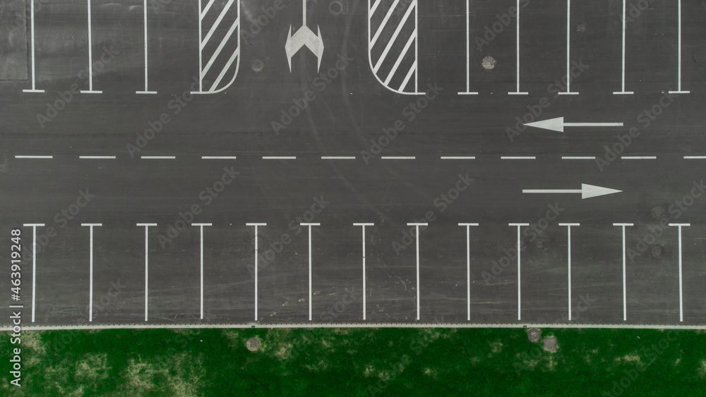 Different lines on a parking lot. PArking spaces and routes with ...