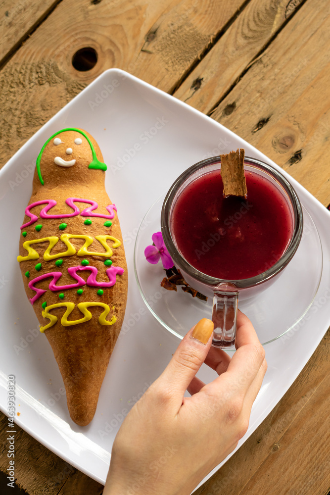Woman's hand gently lifting a cup of the traditional ecuadorian drink ...
