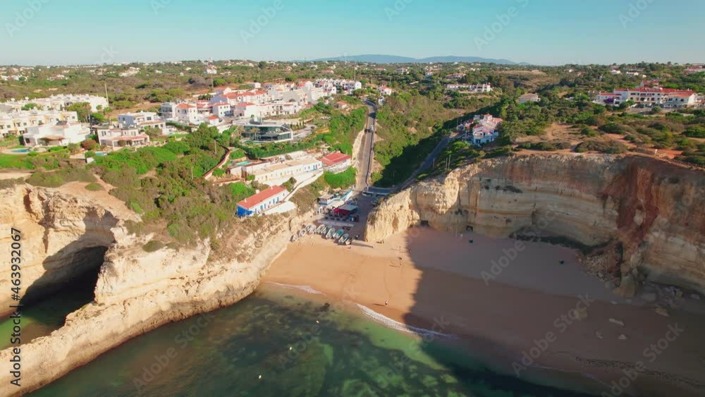 Aerial view of Benagil Beach, boats and vessels, hotels and restaurants ...