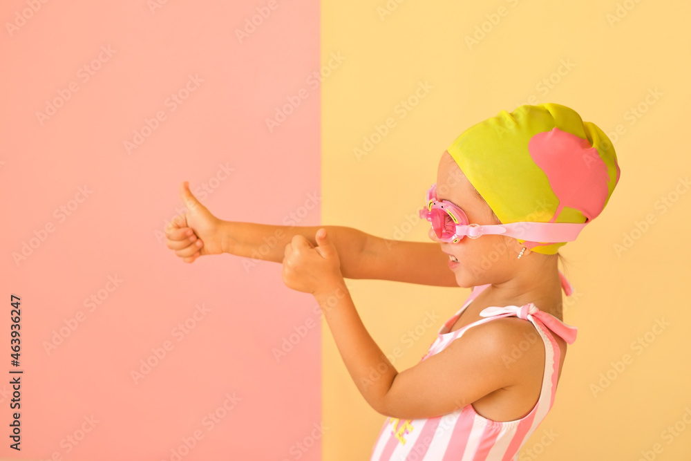 Cheerful positive girl in a trendy striped swimsuit, Swimming Goggles ...