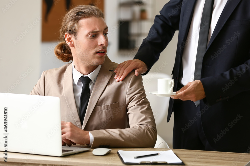 Man seducing his male colleague in office. Concept of harassment Stock ...