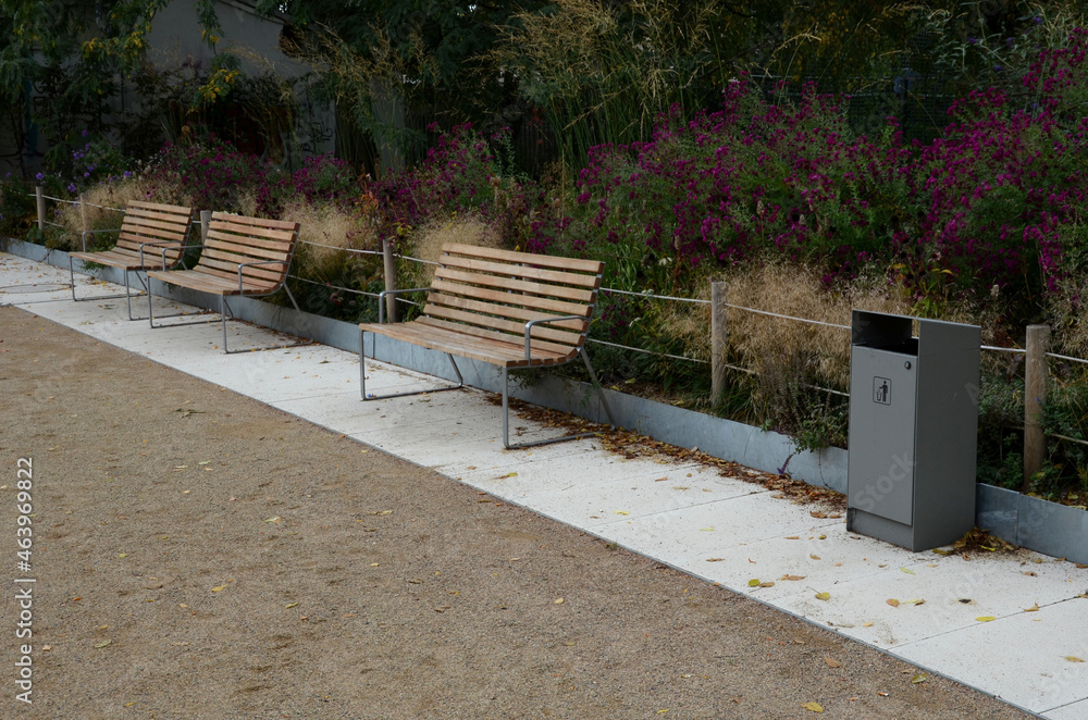 wood benches on their paneling under the benches is a rectangle of ...