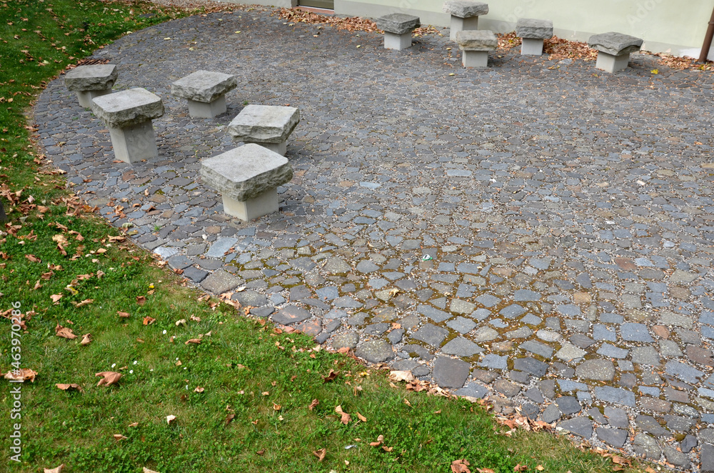 benches in the shape of mushrooms made of solid carved stone ...