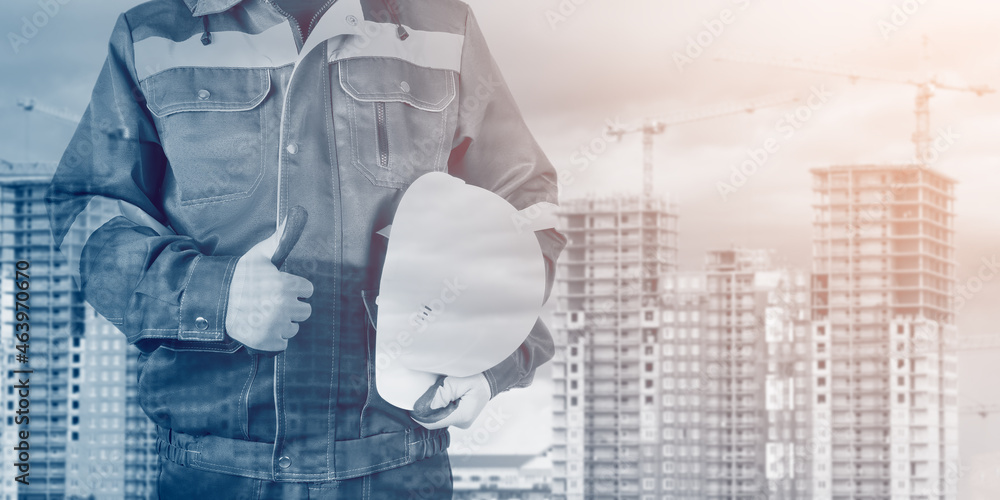 The builder, engineer, architect shows a raised thumbs up hand gesture ...