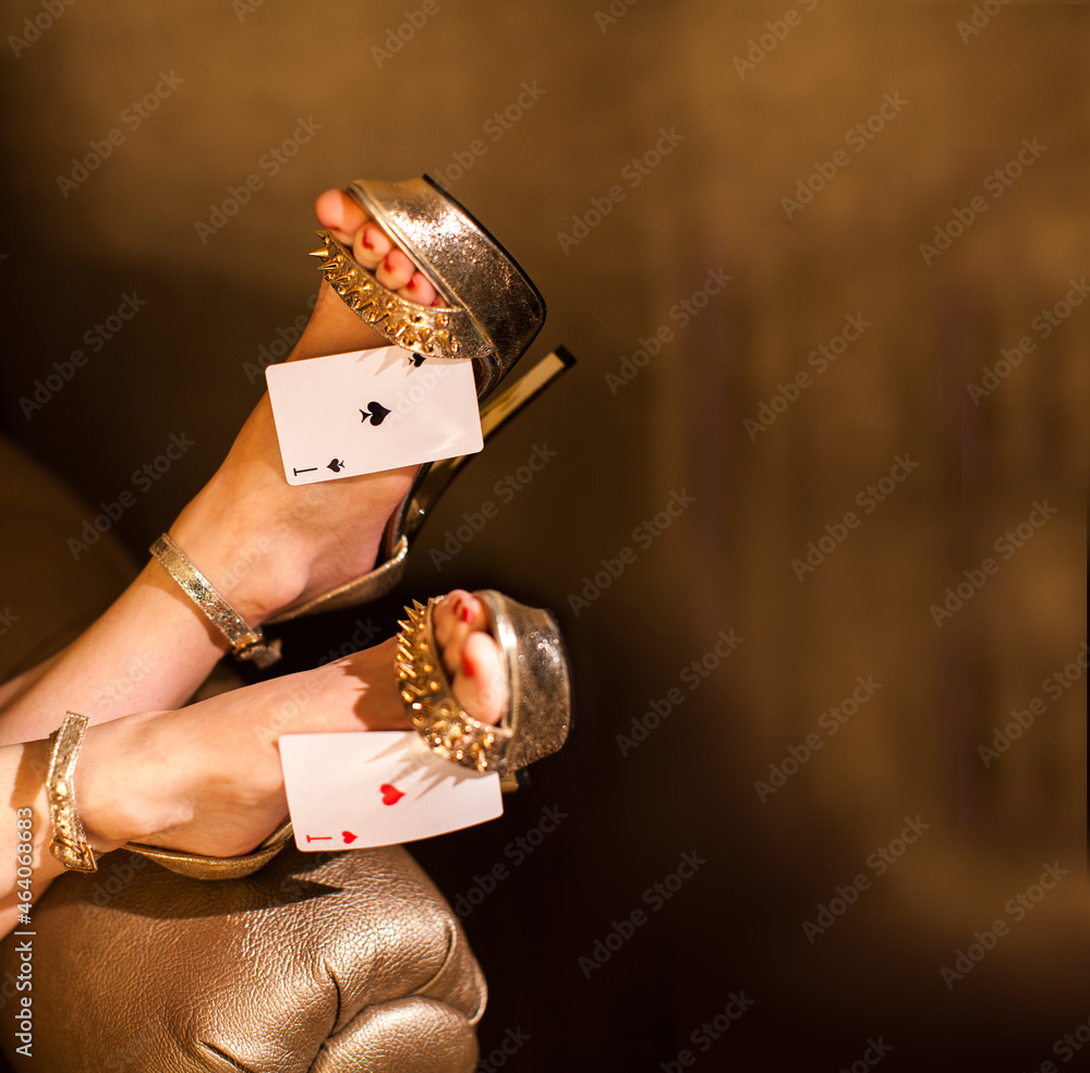 Stiletto Heels of Golden Shoes and Two Cards Aces in These, Showing a Poker Win. Woman's Legs ...