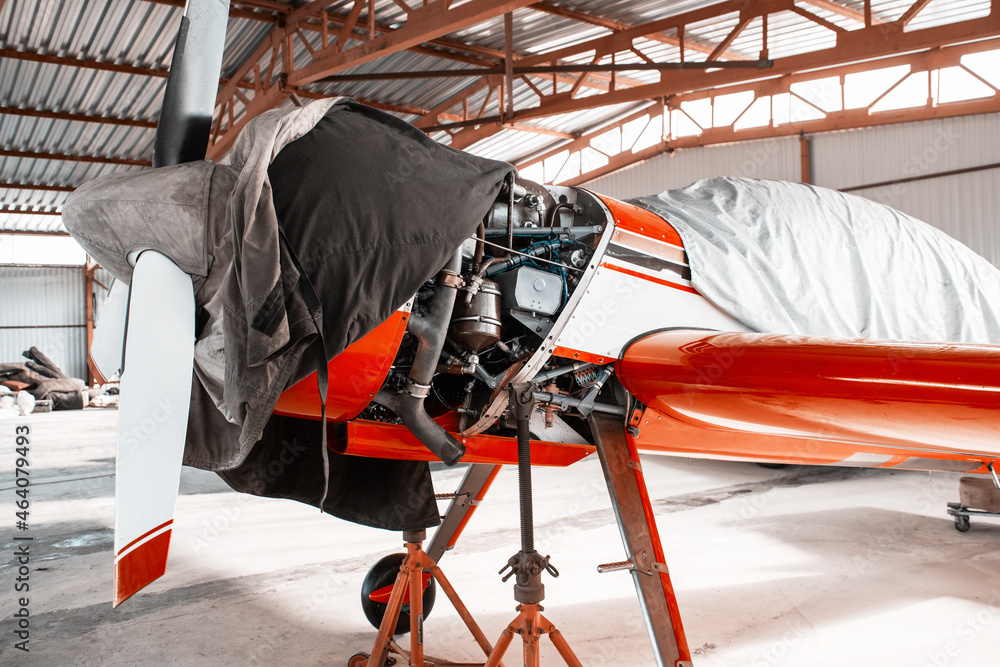 Ultralight small private aircraft airplane on repair in the hangar at ...