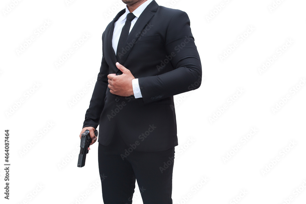 A gun man wearing a black suit is holding a gun in a stalwart pose on a ...