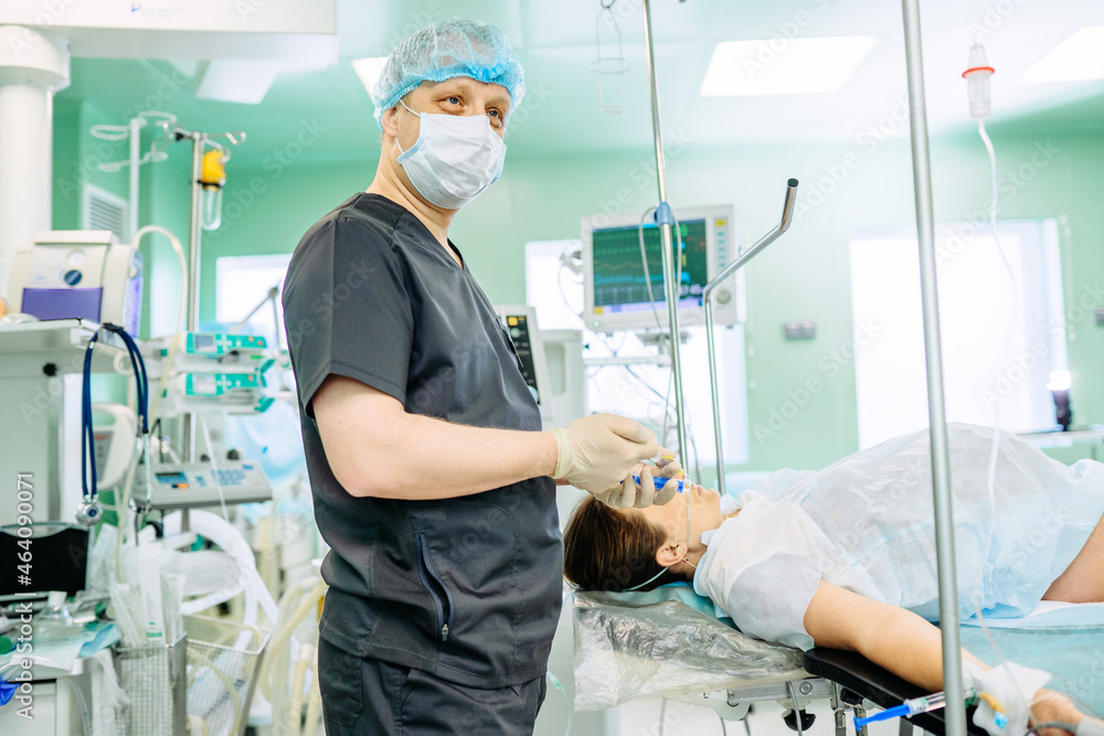 Male doctor injecting Epidural Anesthesia for pregnancy Labor during ...