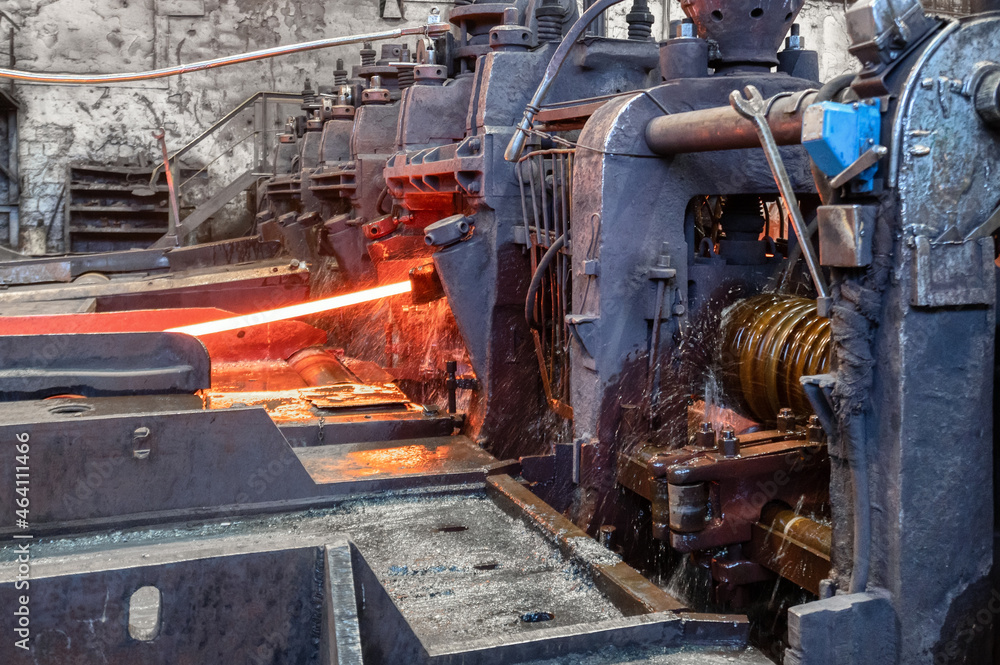 The process of rolling hot rolled steel in a rolling mill Stock Photo ...