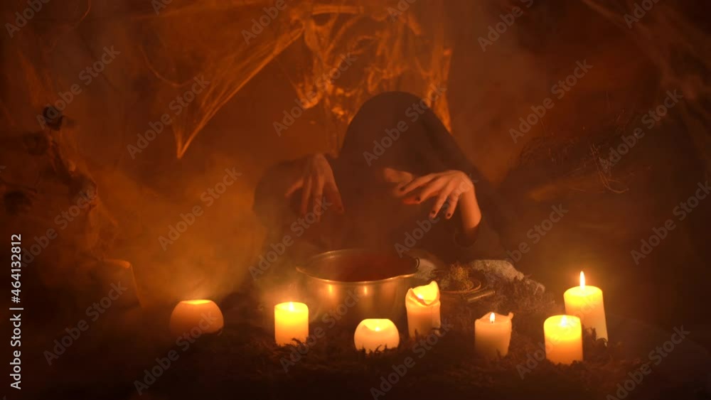 The underworld. Scary witch does voodoo black magic ritual near the ...