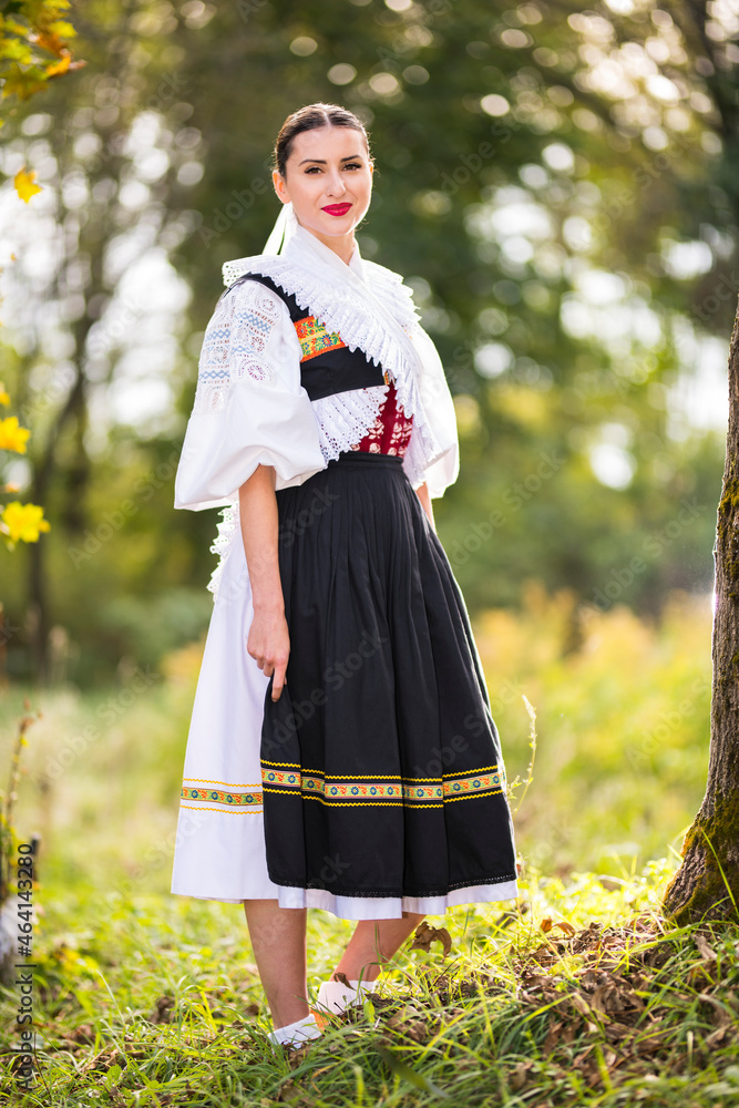 Young beautiful slovak woman in traditional dress. Slovak folklore ...
