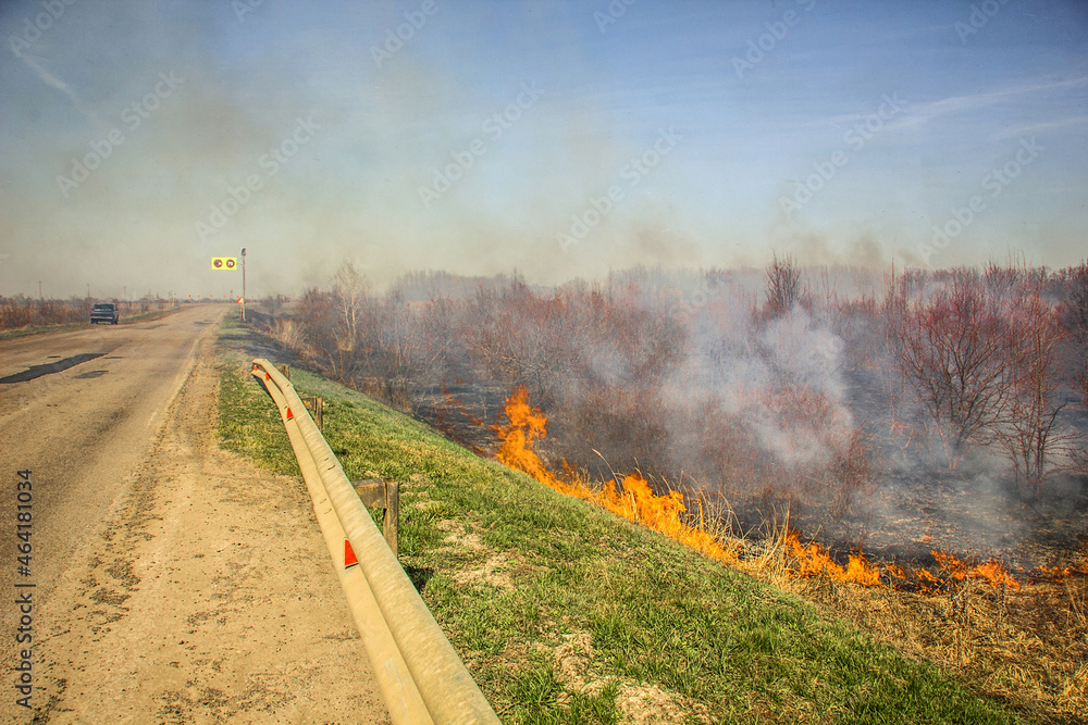 Road, highway in Taiga of Siberia and the Far East, Russia. Fire in the ...