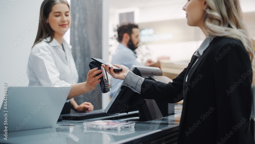 Clothing Store: Young Woman At Counter Buys Clothes from Friendly ...