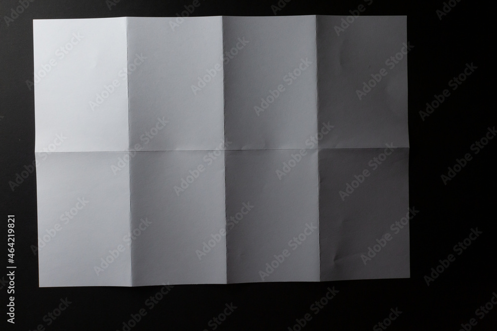 Stockfoto Light and shadow on creases in sheet of white paper folded ...