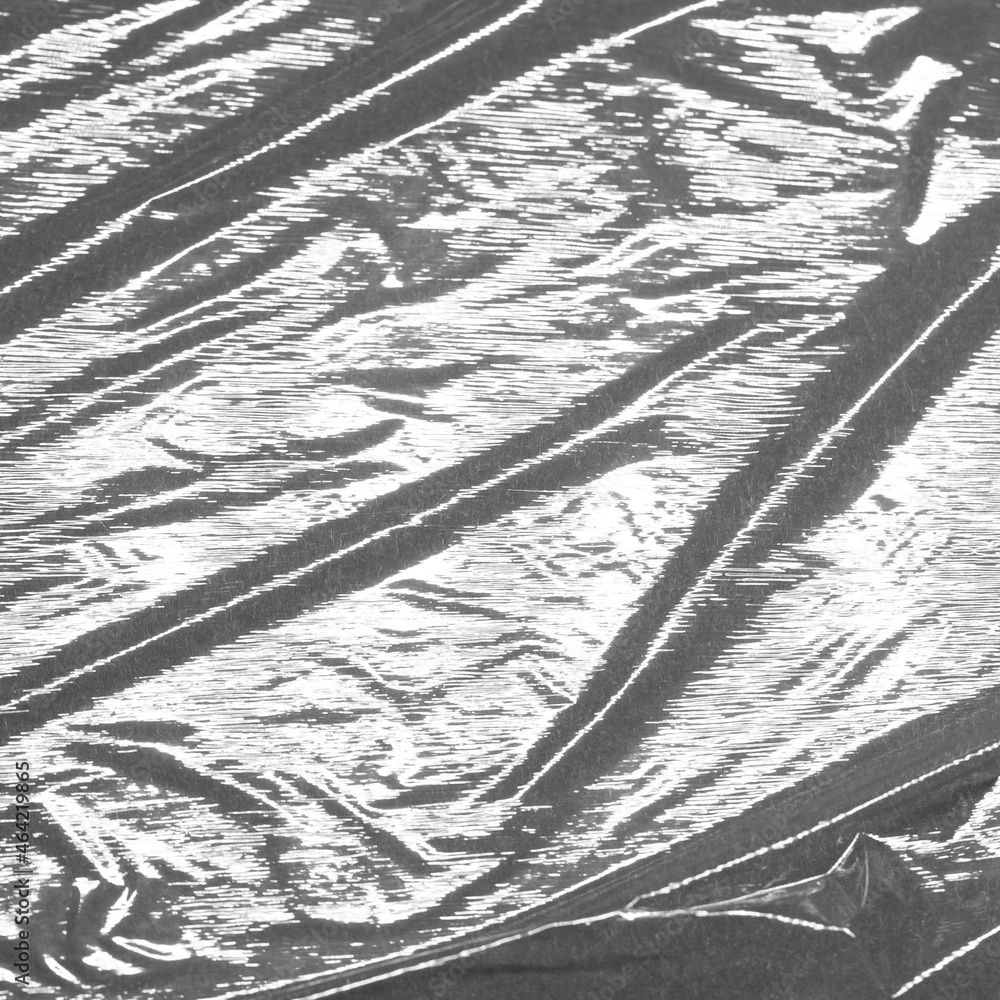 Reflecting light and shadow on creases and folds in shiny fabric or ...