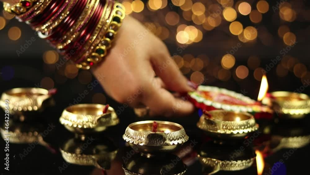 Beautiful Hands Of Girl Wearing Choodi Illuminates Metal Brass Diya ...