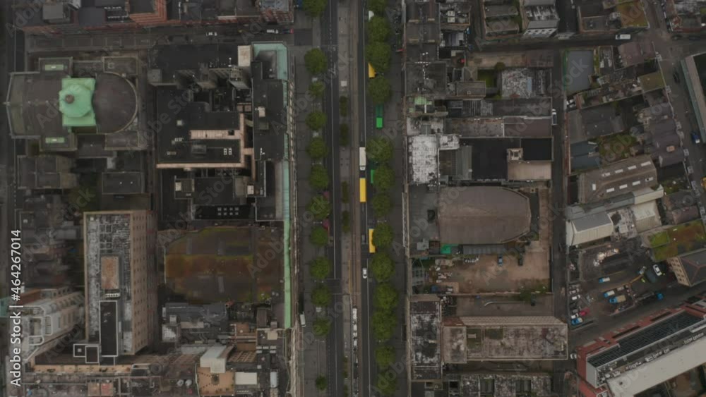 Aerial birds eye overhead top down panning view of wide street leading ...