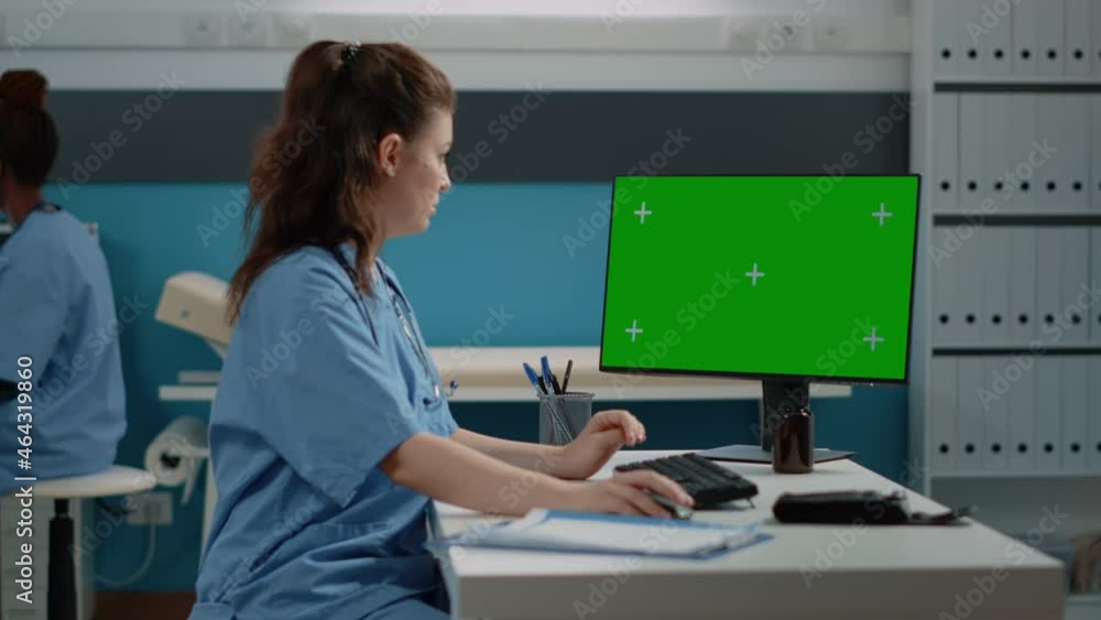 Healthcare assistant using computer for horizontal green screen in ...