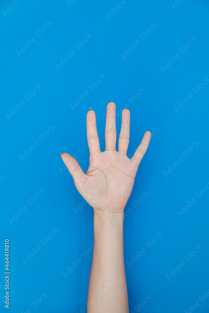 hand showing number five In front of the blue background Stock Photo ...