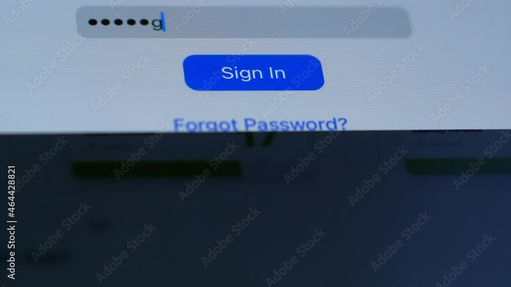 Close-up on the screen of a mobile device entering login and password ...