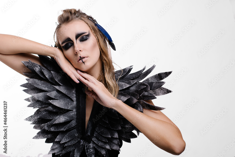 Beautiful woman in makeup and costume for halloween on a white ...