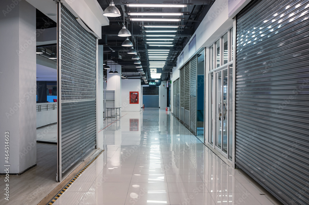 Abandoned corridor closed shutter shop in department store Stock Photo ...