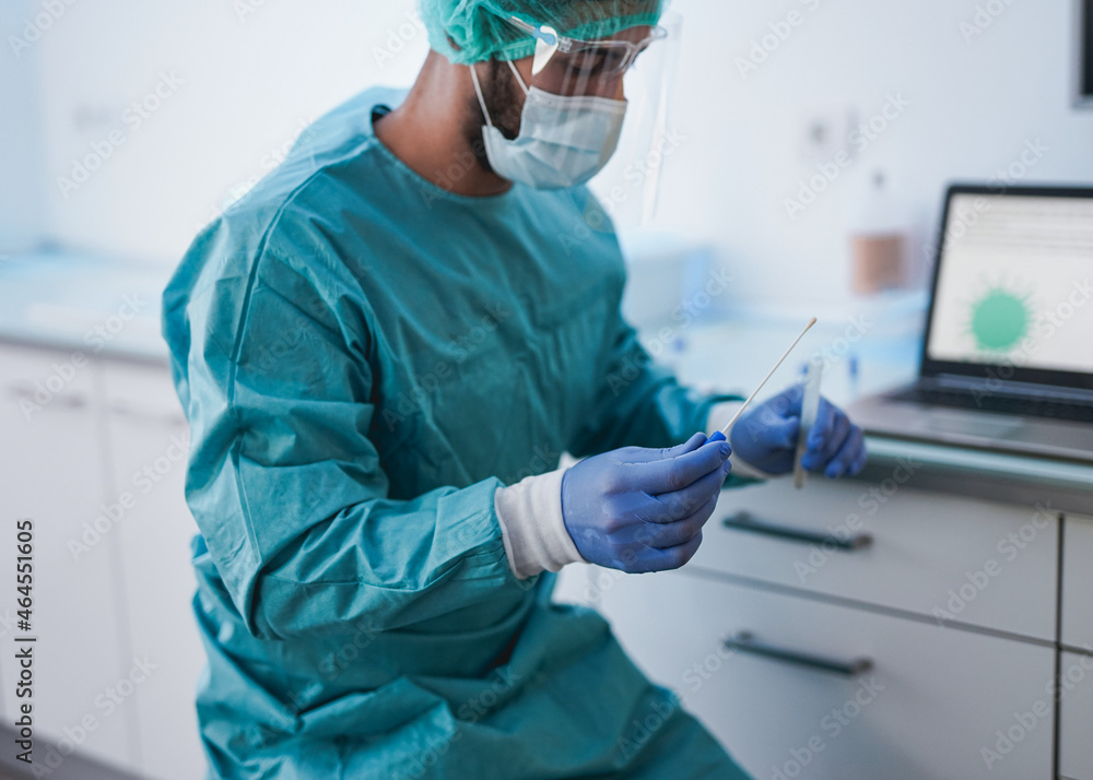Medical doctor holding cotton nose swab test inside hospital ...
