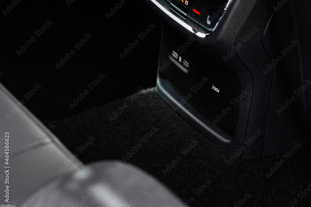 12V and 220v power outlet socket in the car. Closed sockets. Stock ...