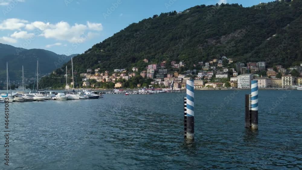 Camera panning over Como marina in Lake Como in Italy. In the ...