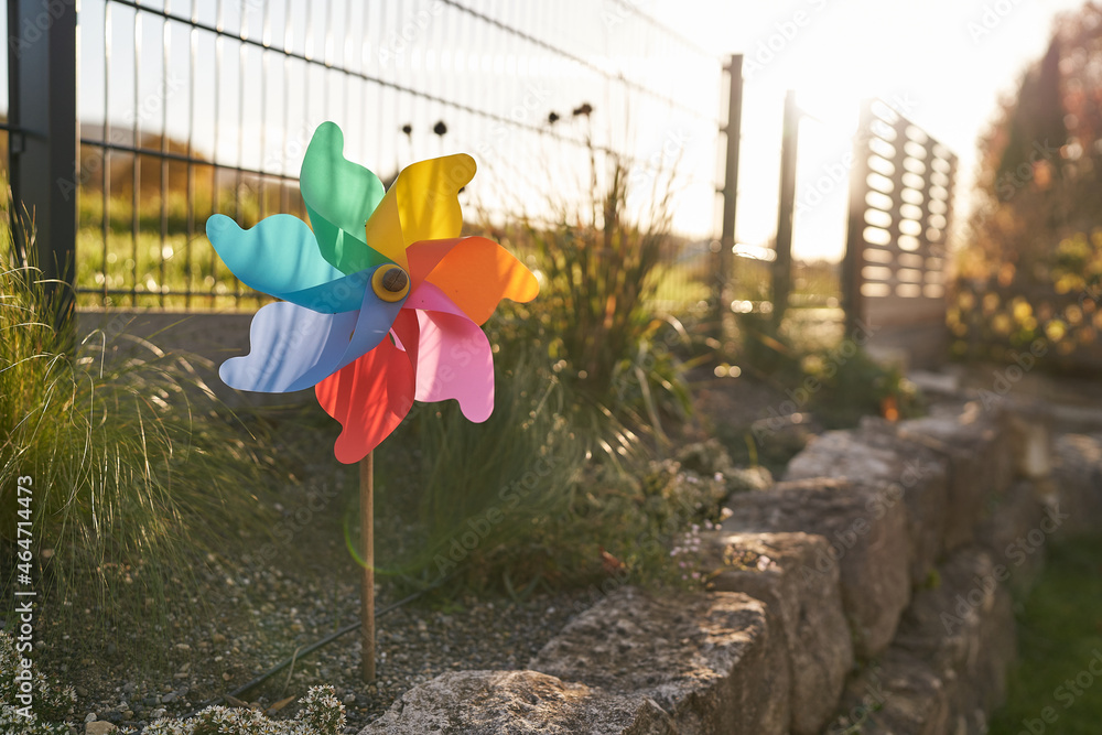 Buntes Windrad im Garten Stock Photo | Adobe Stock