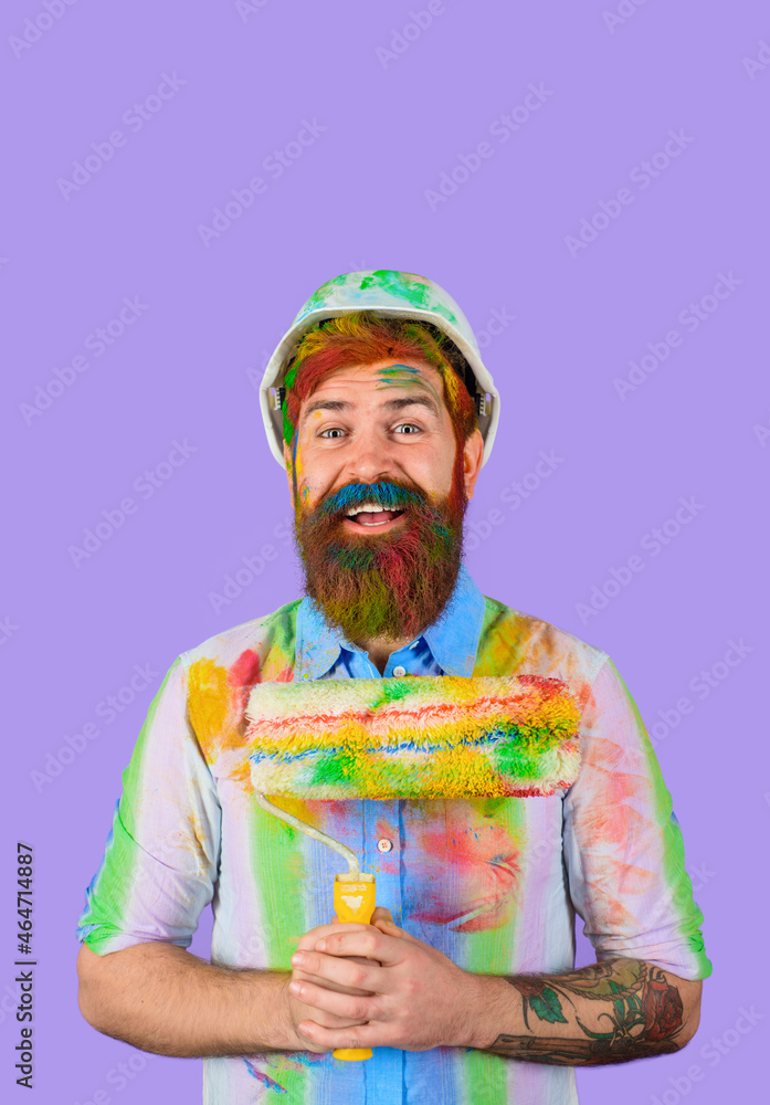 Painter. Bearded painter in protect helmet. Paint roller. Painter with ...