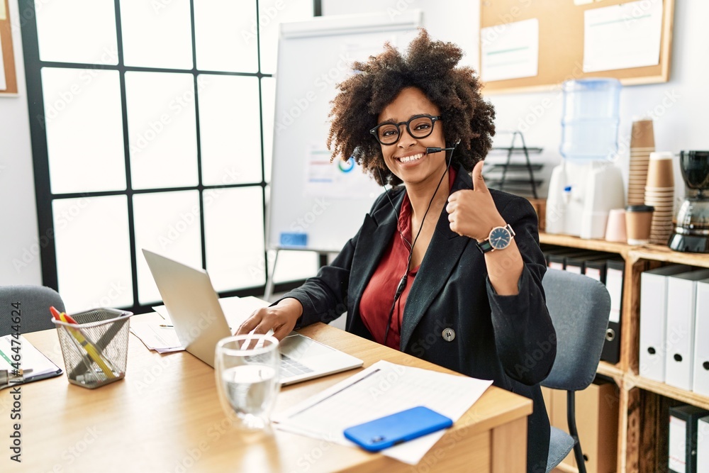 African american woman with afro hair working at the office wearing ...