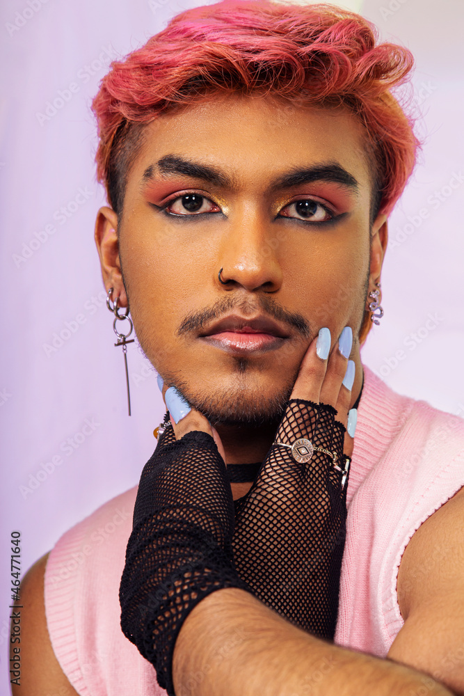 Malaysian Indian men posed in front of a cloth backdrop in a studio ...