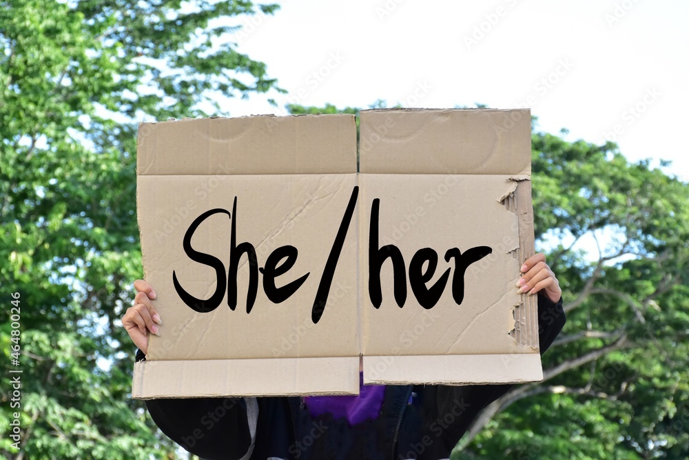 Subject and object pronouns 'She and her' on paper holding in hands of ...