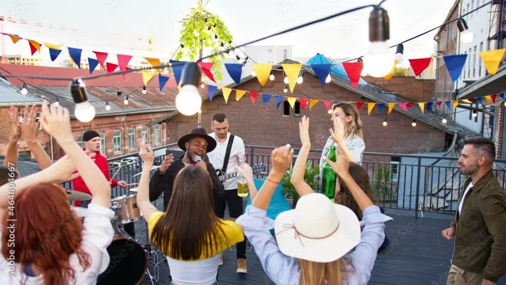 Band with guitarist, drummer and singer performing at a concert on ...