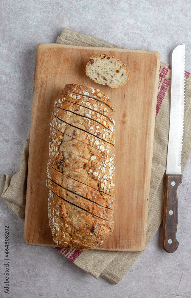 Rye bread loaf with seeds, raisins and muesli. Healthy food concept ...