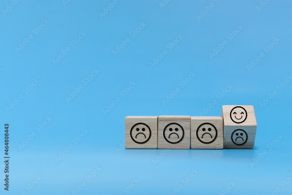 Happy and Unhappy emotion. happy smile face with sad face on wooden ...