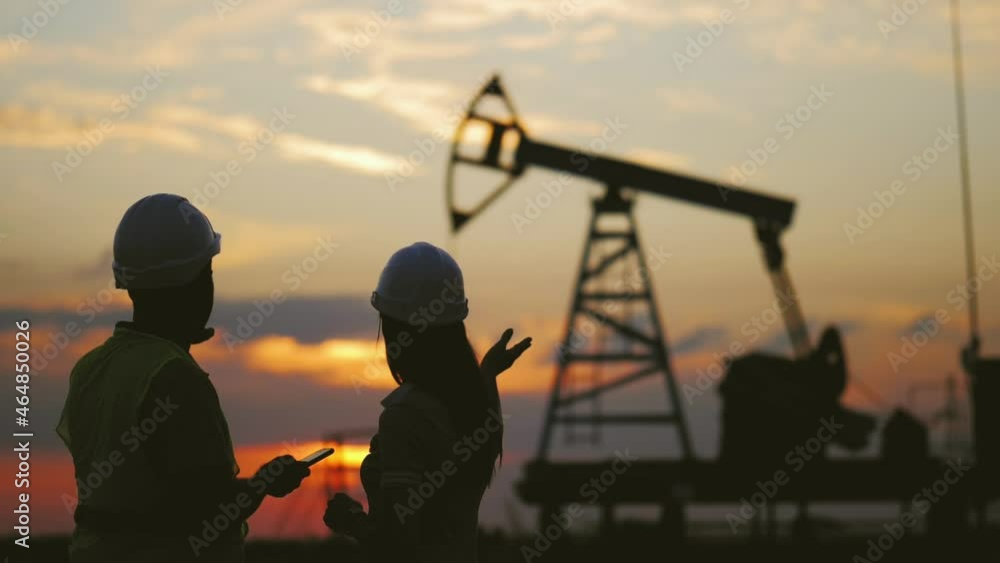 Industrial, oil and teamwork. A team engineers discussing the ...