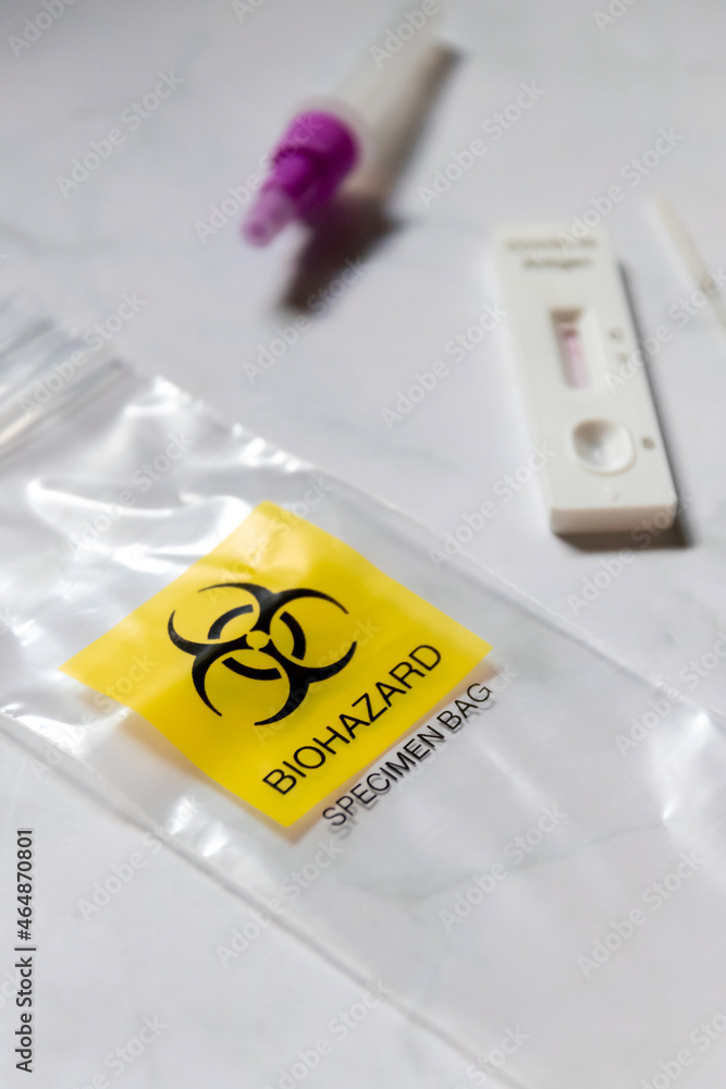 Covid-19 Rapid Antigen Test kit and biohazard specimen bag on white ...