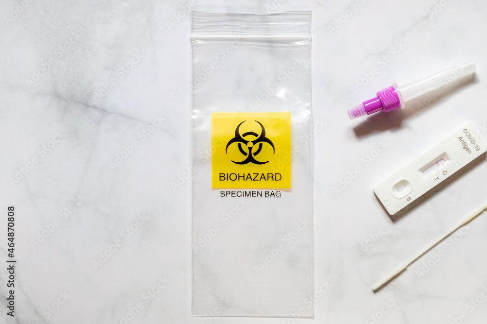 Covid-19 Rapid Antigen Test kit and biohazard specimen bag on white ...