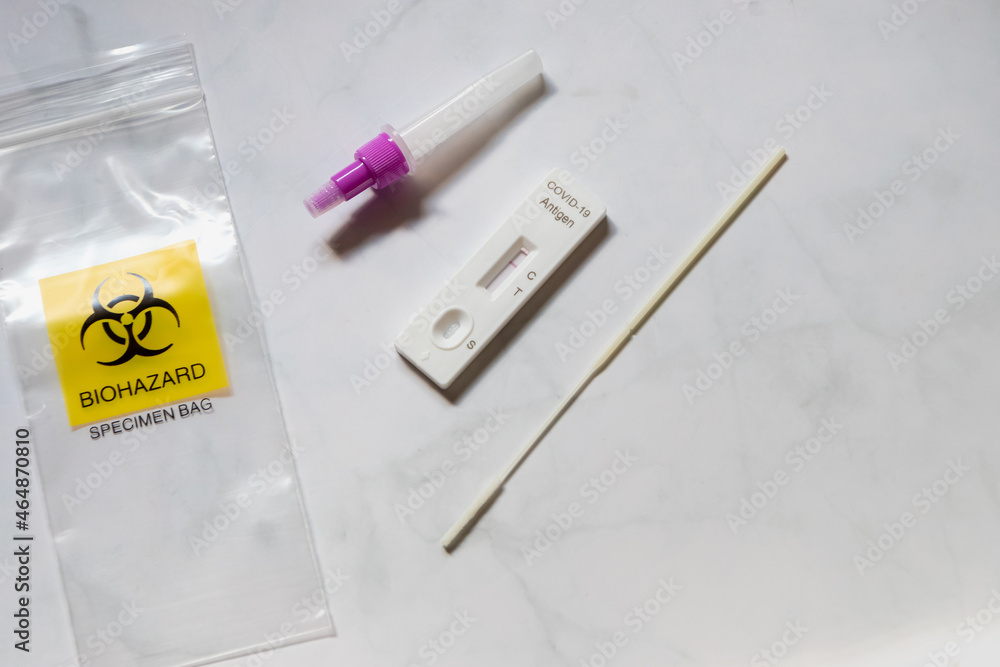 Covid-19 Rapid Antigen Test kit and biohazard specimen bag on white ...