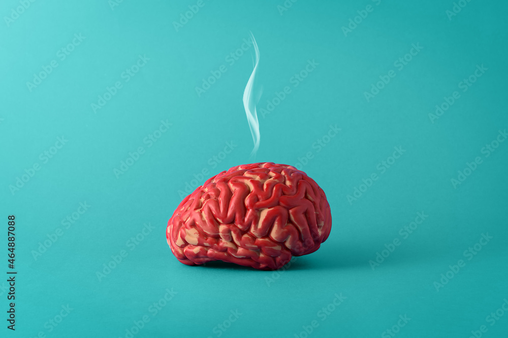 Creative concept of a tired brain on a blue background. Human brain ...