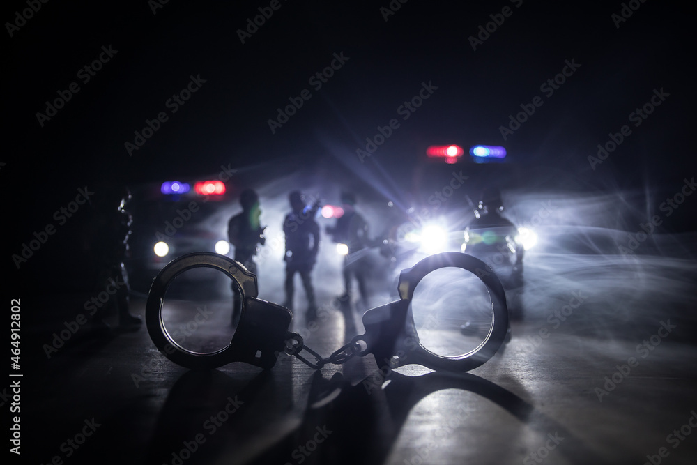 Police raid at night and you are under arrest concept. Silhouette of ...