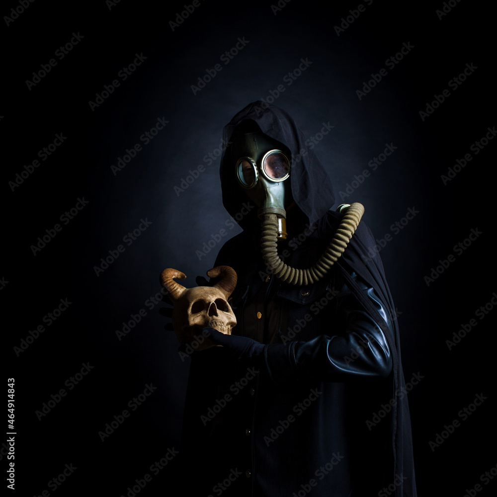 post-apocalyptic angel of death with a demon skull in his arms, a scary ...